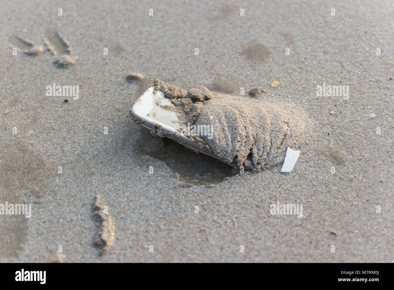 Mobile phone floated to the sea at the beach Stock Photo - Alamy