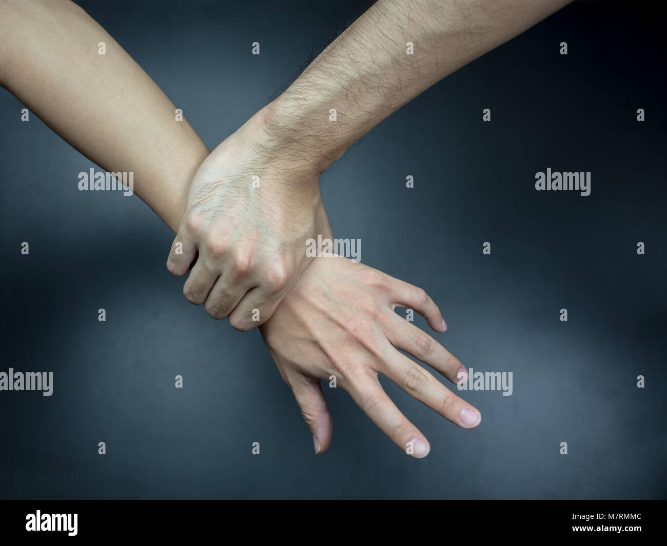 Hand catching others wrist, getting caught Stock Photo - Alamy