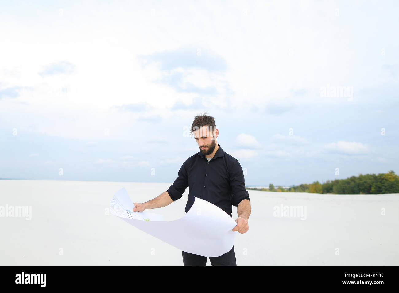 Archeologist man reviewing plan of excavations in village talk Stock ...