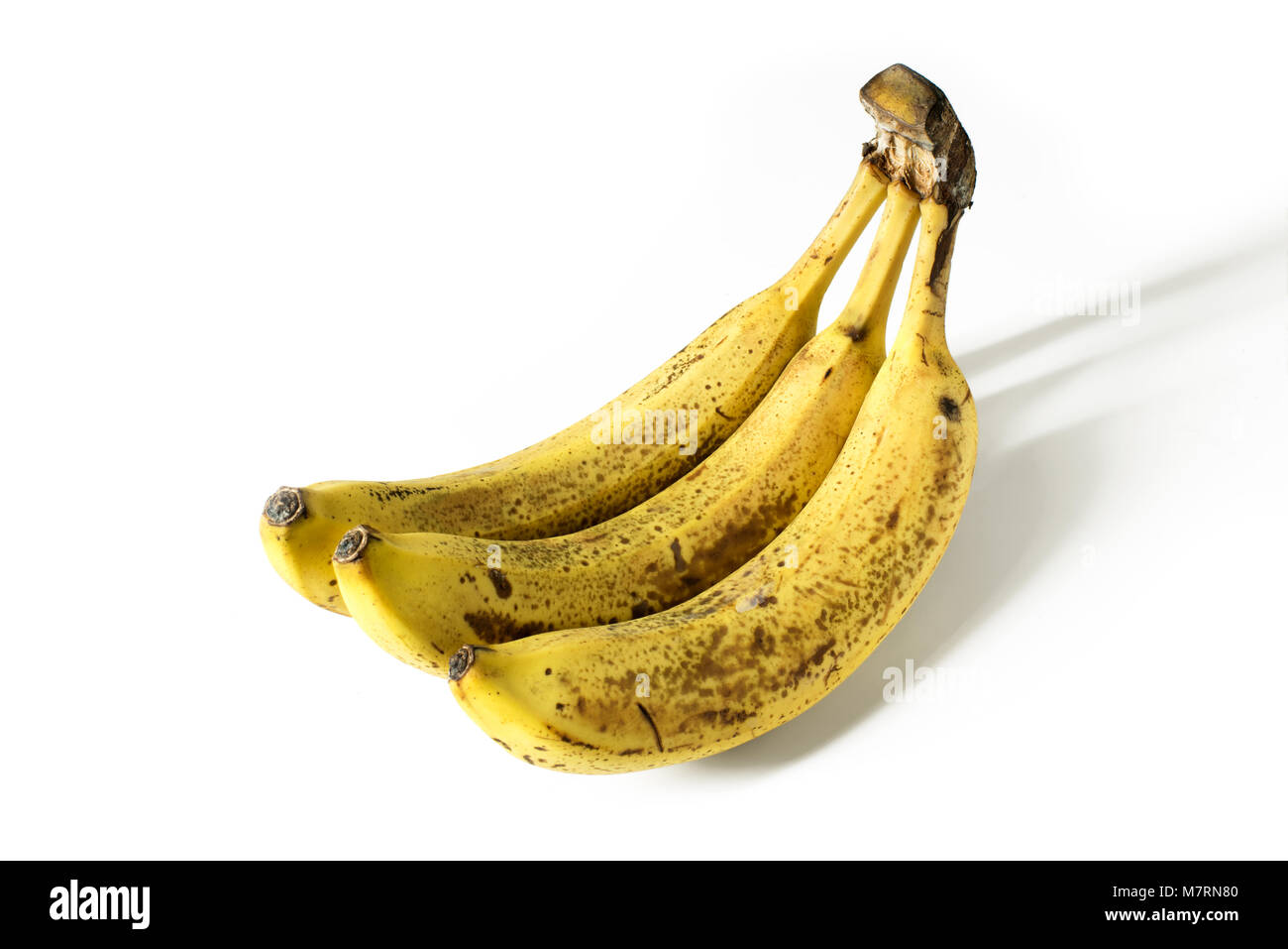 Bunch of three very ripe bananas isolated on white background Stock ...