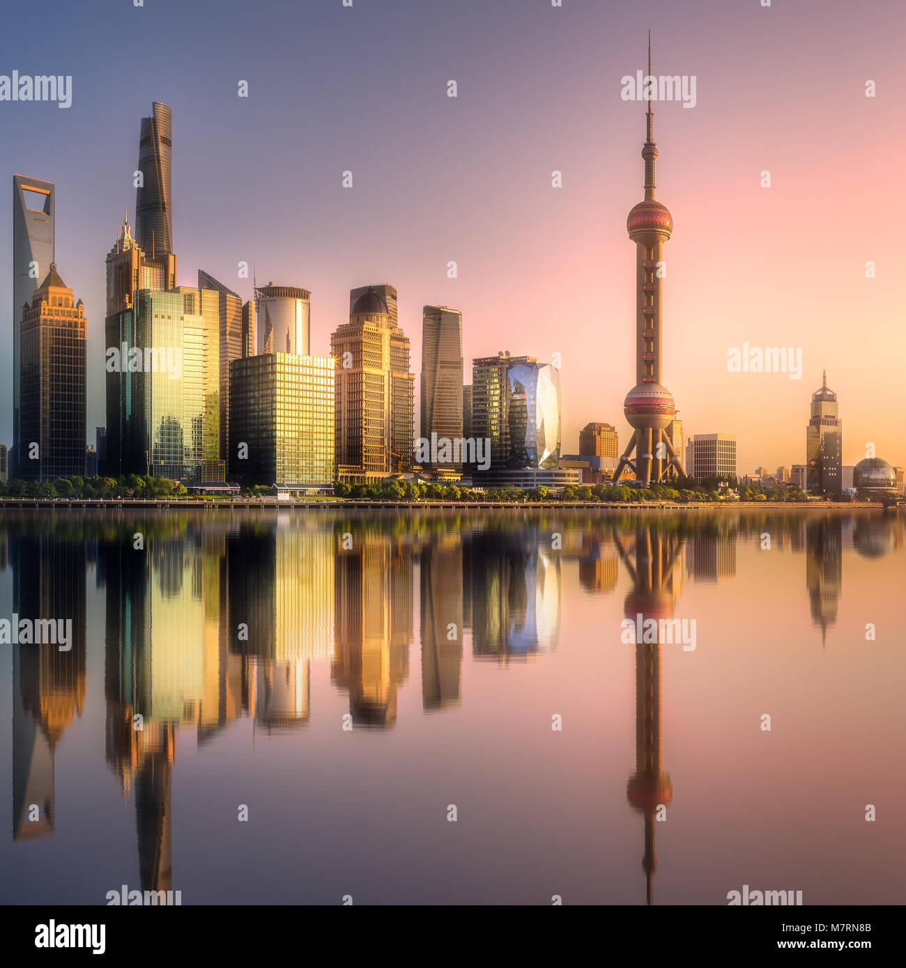 Shanghai skyline with reflection of sun on water Stock Photo - Alamy