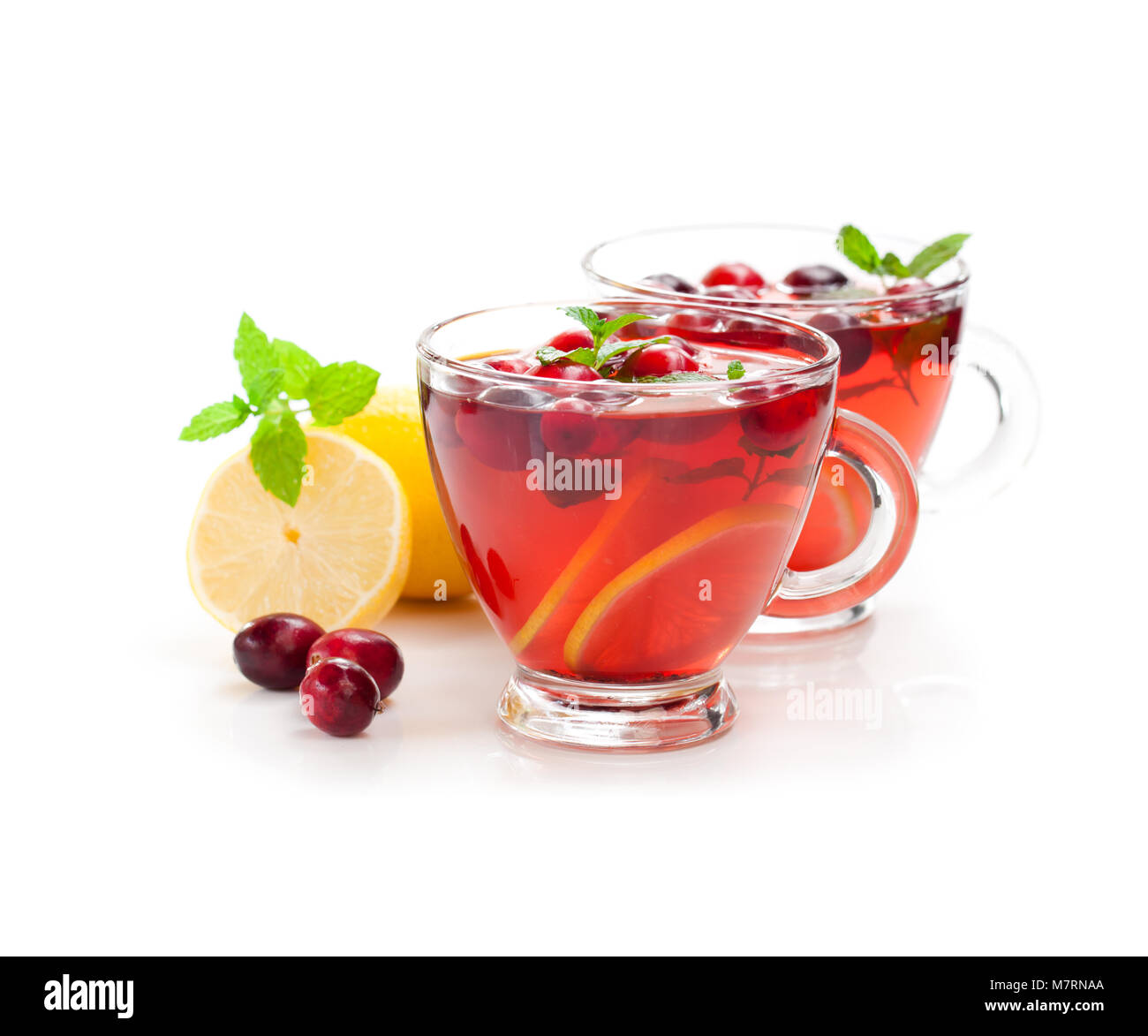 Red fruit tea with lemon and cranberry isolated on white background ...