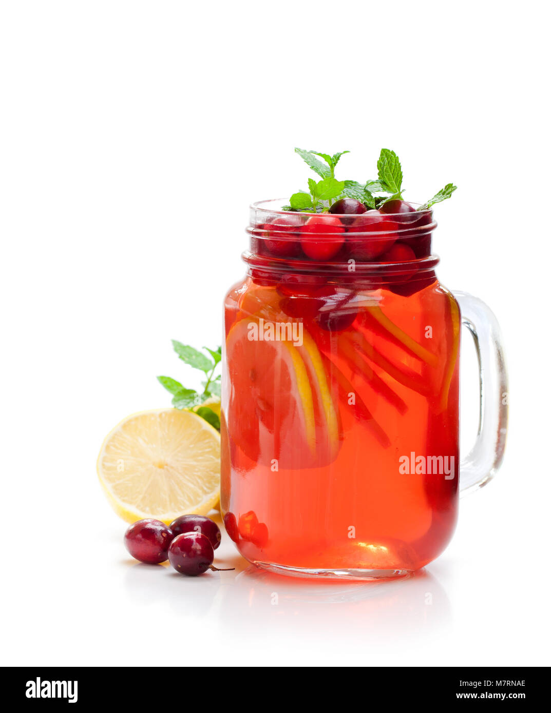 Red fruit tea with lemon and cranberry isolated on white background ...