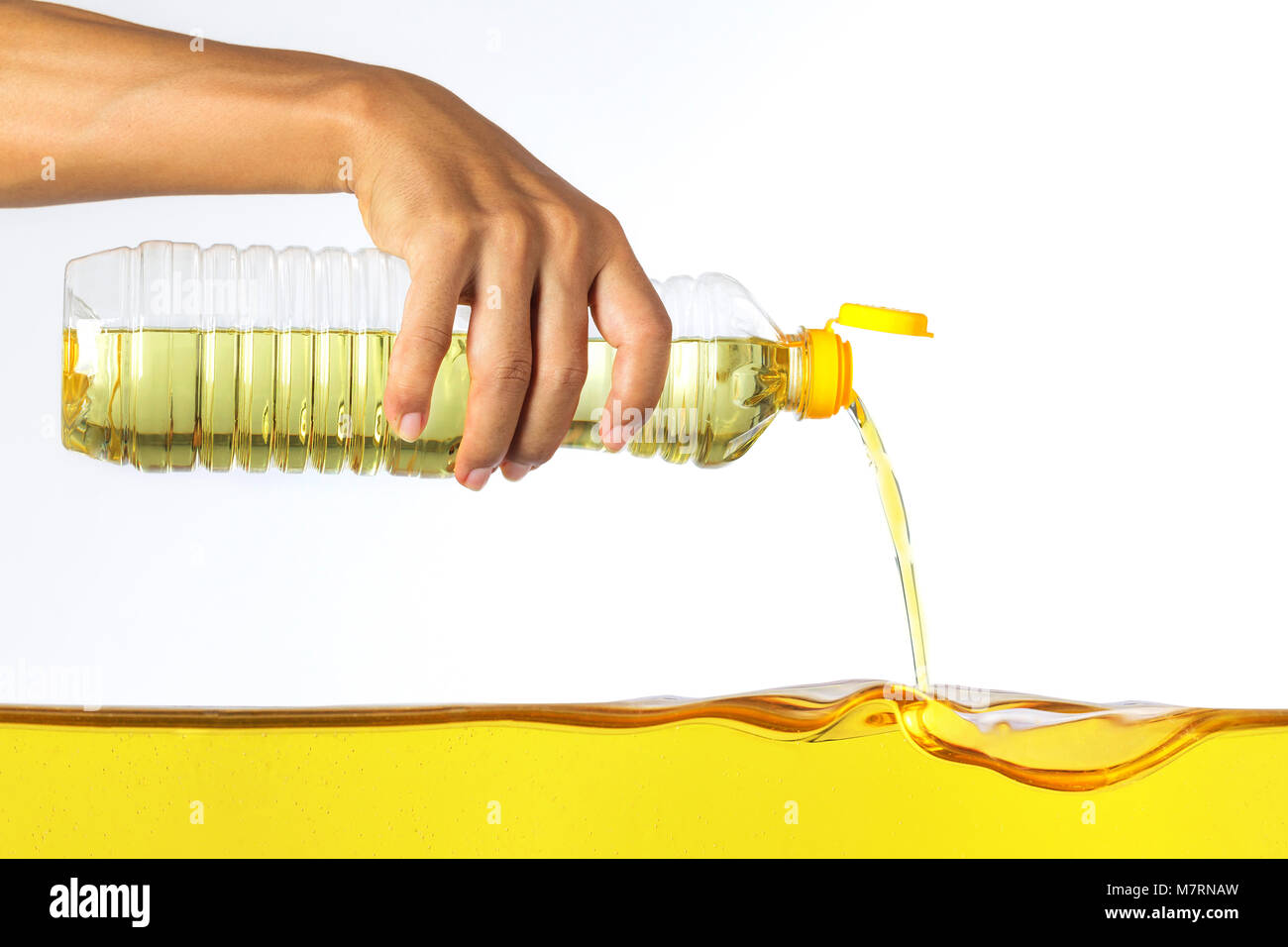 Vegetable oil pouring on vegetable oil background Stock Photo - Alamy