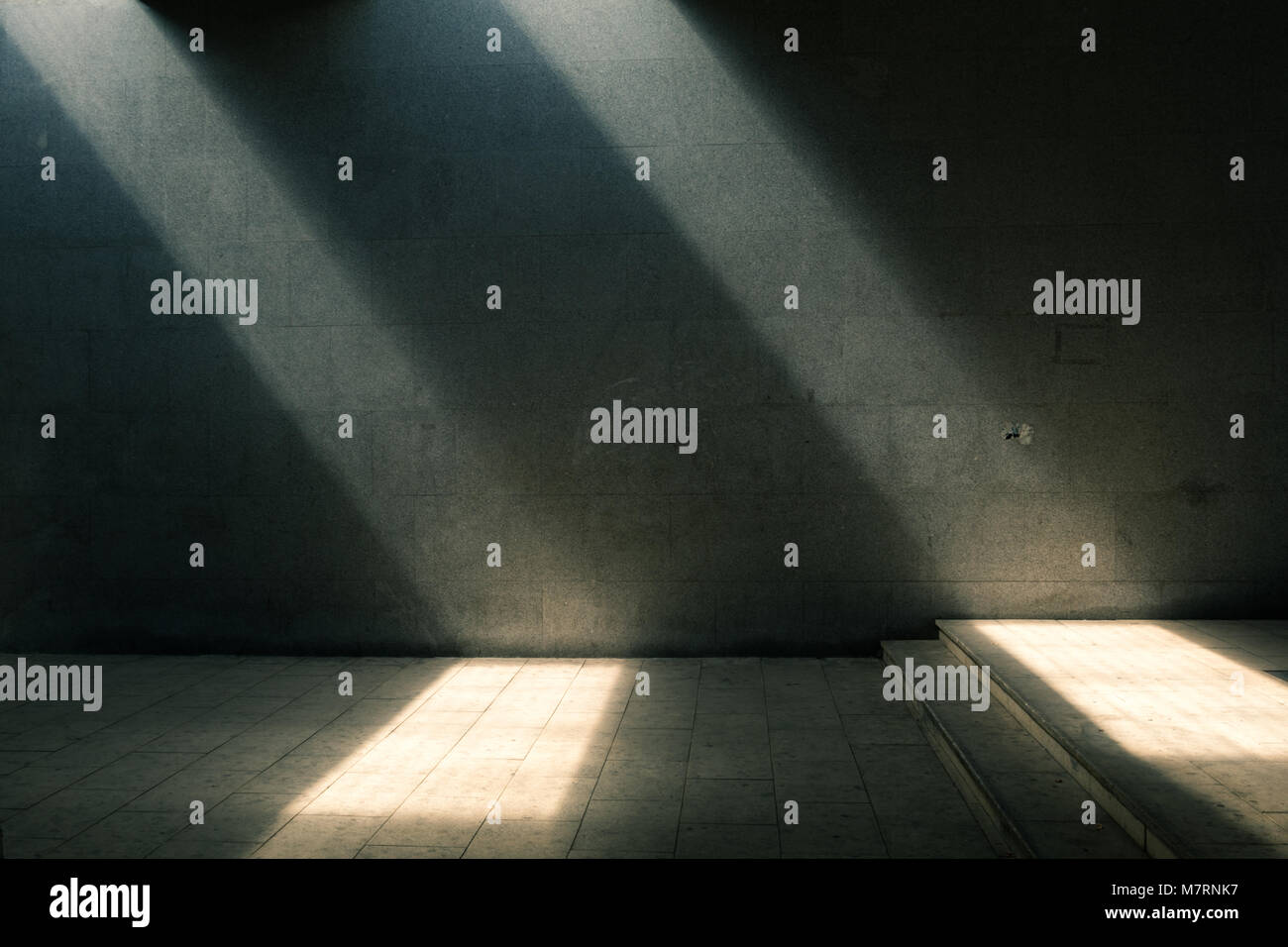Modern urban passage with dramatic light Stock Photo - Alamy