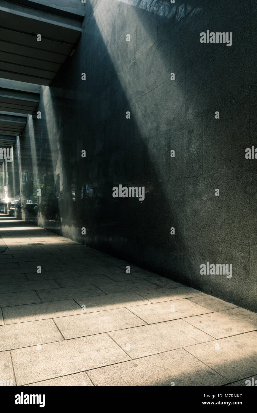 Modern urban passage with dramatic light Stock Photo - Alamy