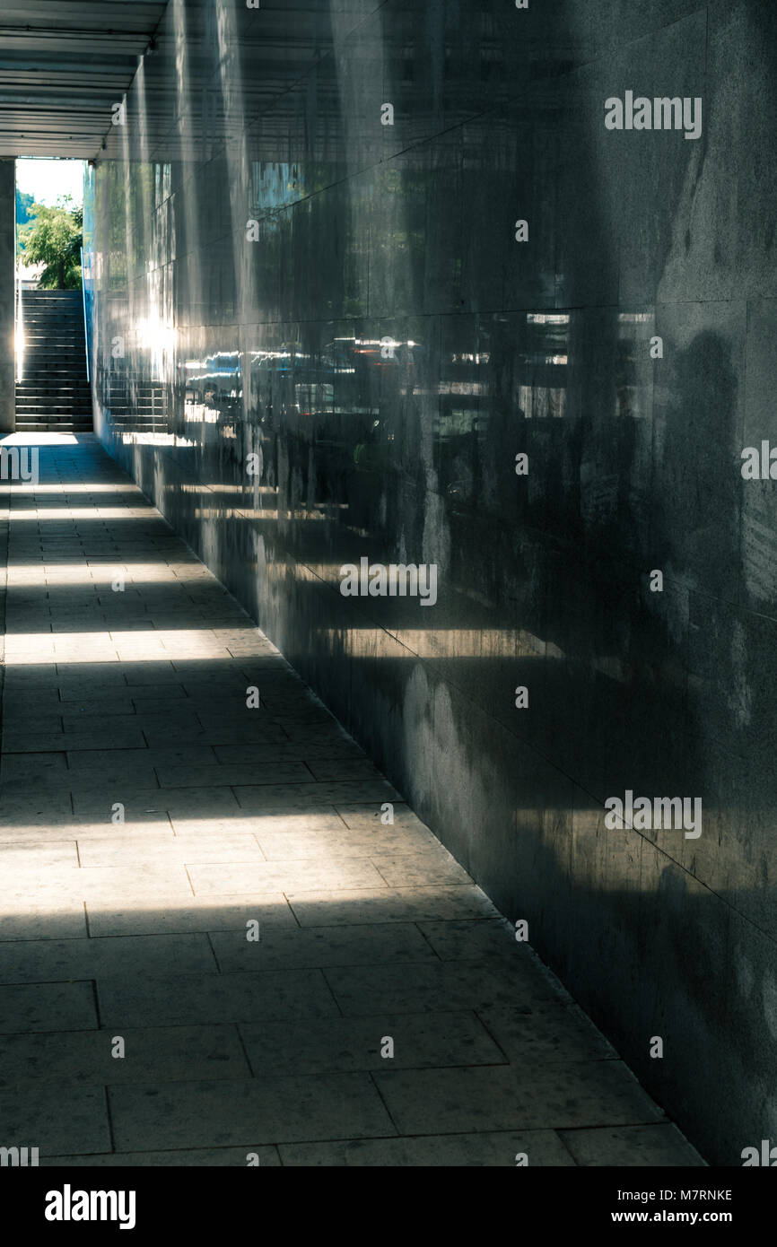 Modern urban passage with dramatic light Stock Photo - Alamy