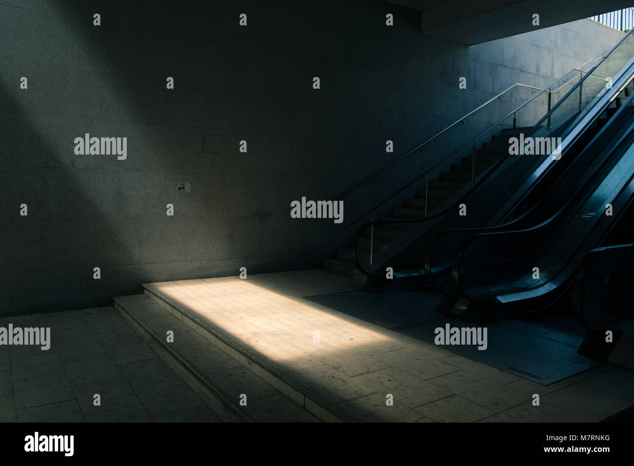 Modern urban passage with dramatic light Stock Photo - Alamy