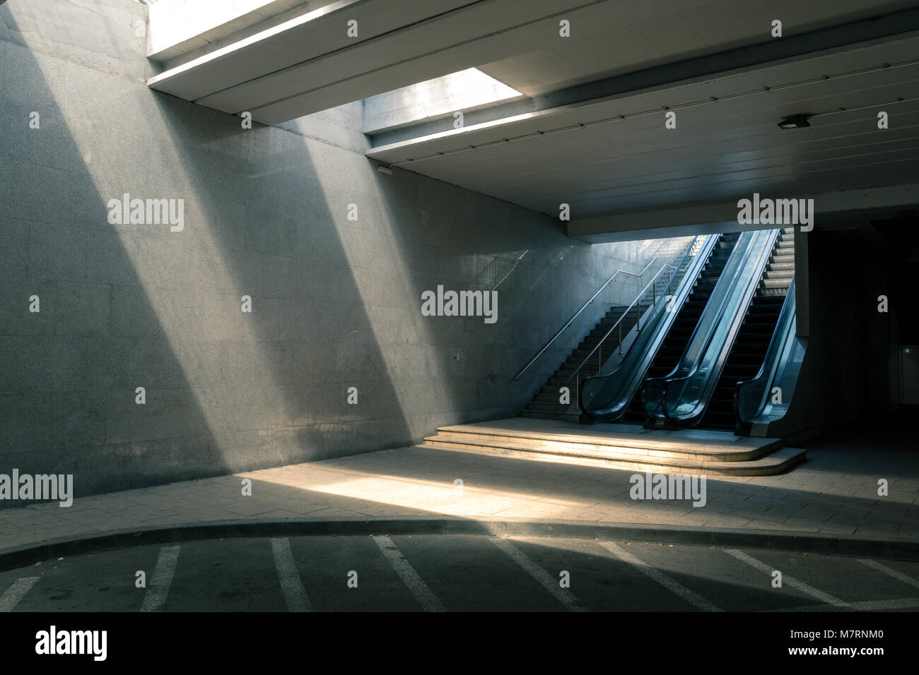 Modern urban passage with dramatic light Stock Photo - Alamy