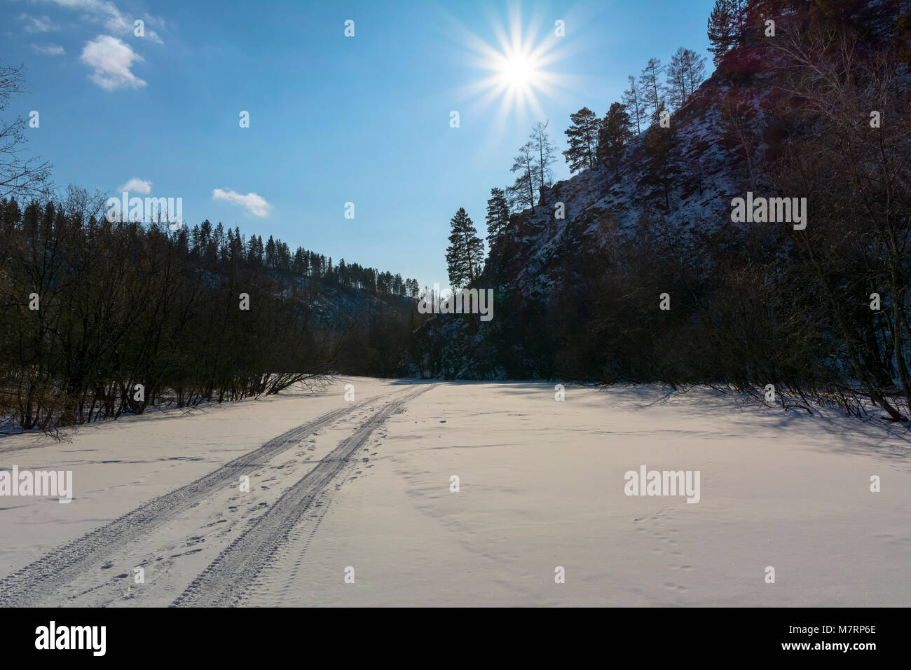 Frosty winter landscape with river. Sky sun and snow Stock Photo - Alamy