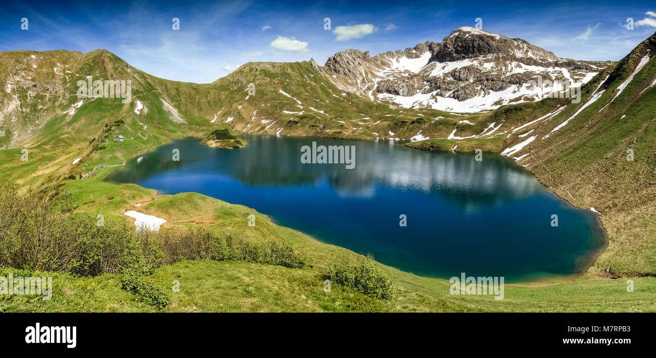 Remote Schrecksee lake up high in the alpine mountains in spring or ...
