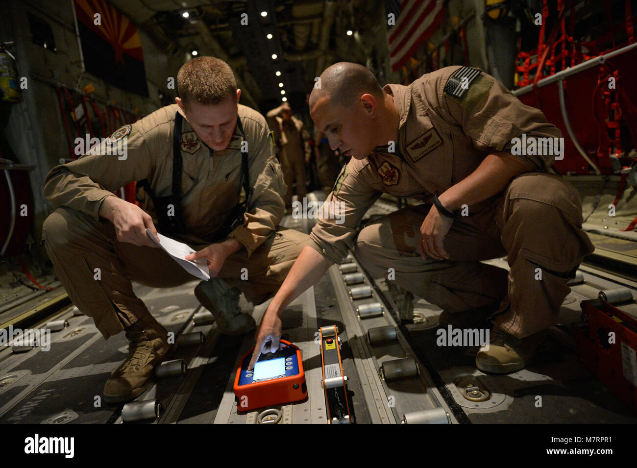 (From left) U.S. Air Force Senior Airmen Korey King and Stefan Eiermann, 774th Expeditionary ...
