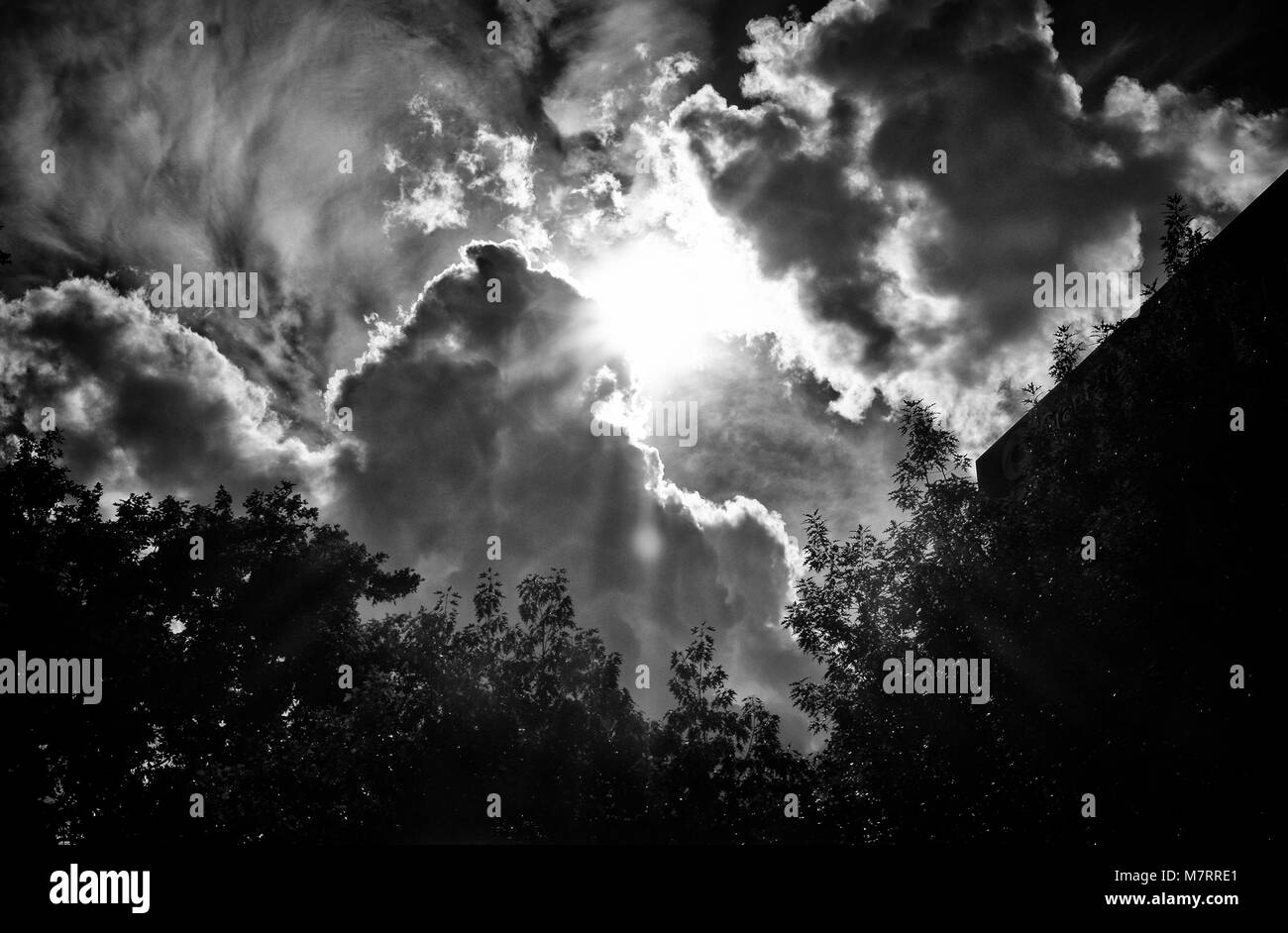 Sunburst through clouds hi-res stock photography and images - Alamy