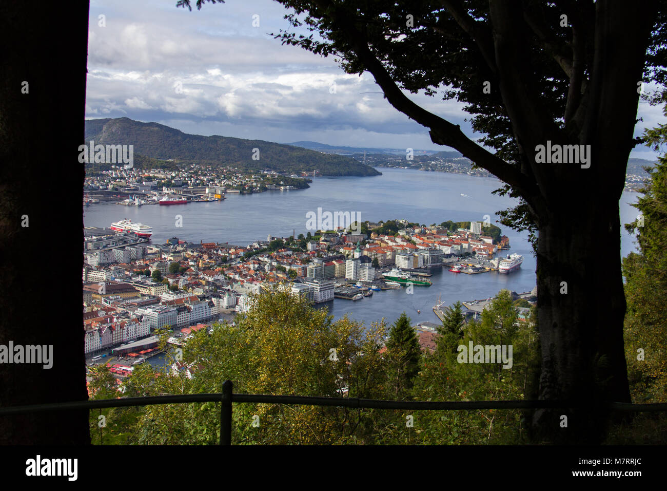 The fjord in Bergen, Norway as viewed through a frame of trees from an ...