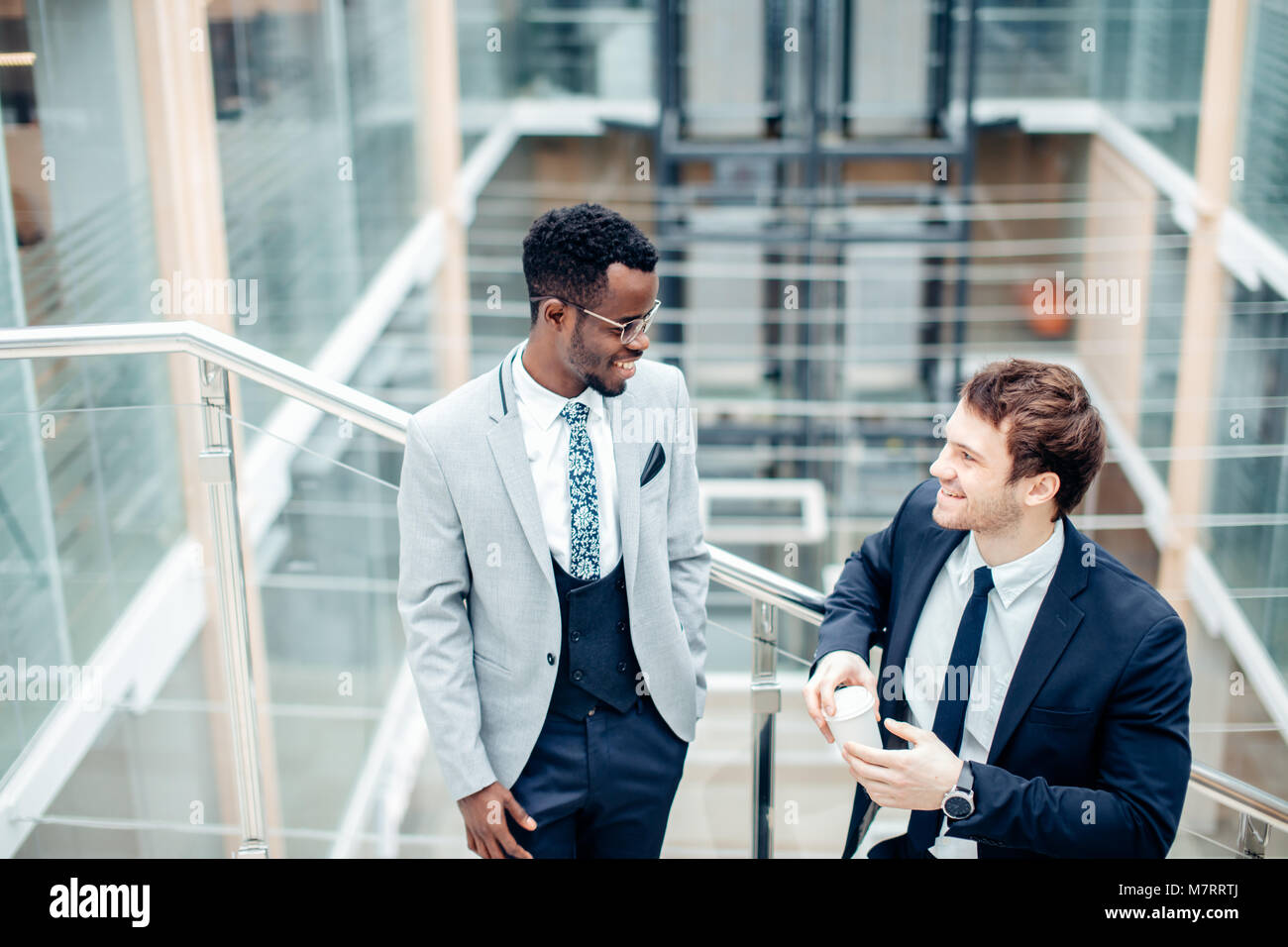 Two multiethnic male employees hi-res stock photography and images - Alamy