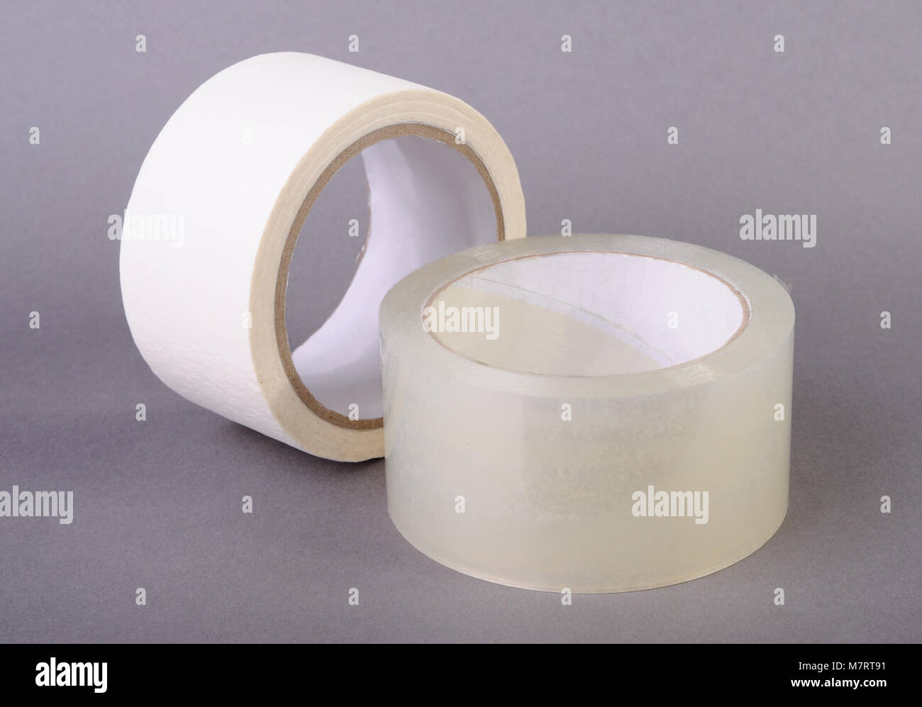 Rolls of tape on gray background Stock Photo - Alamy