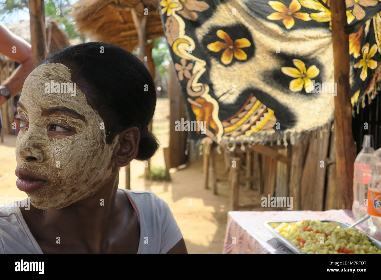 Sakalava woman is wearing clay on her face in a Malagasy village ...