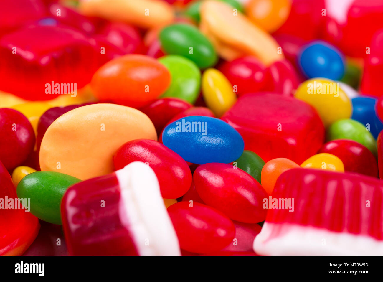 background of colorful candies in different shapes Stock Photo - Alamy