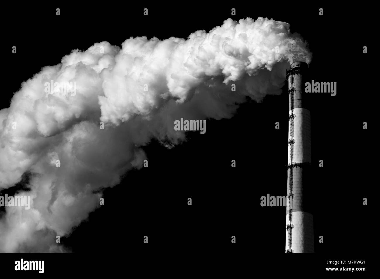 Dense smoke from a chimney Black background Stock Photo - Alamy