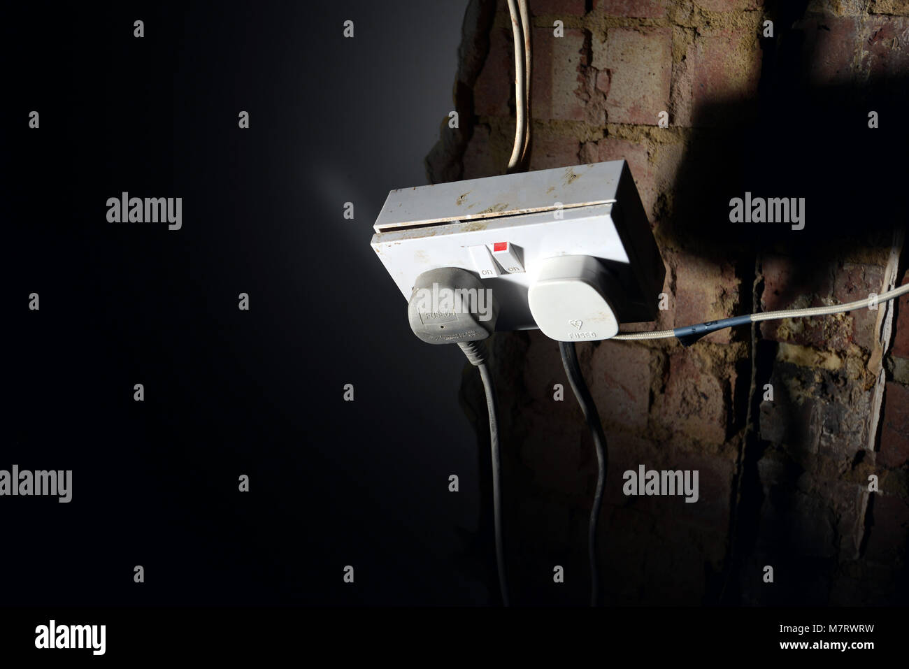 Dangerous wiring on a UK electricity socket Stock Photo - Alamy