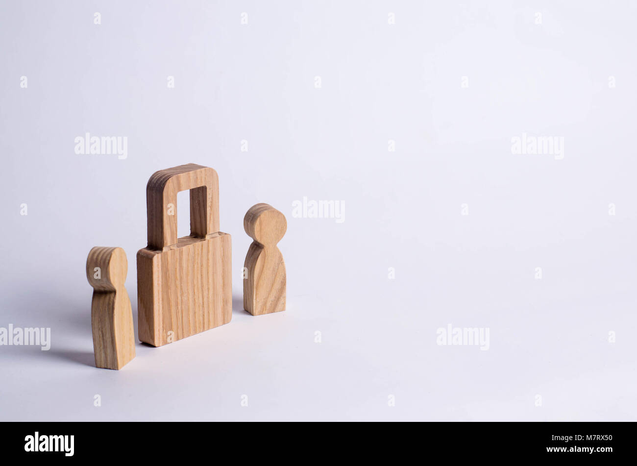 Two people stand near a padlock and keep secrets, information, entrance ...