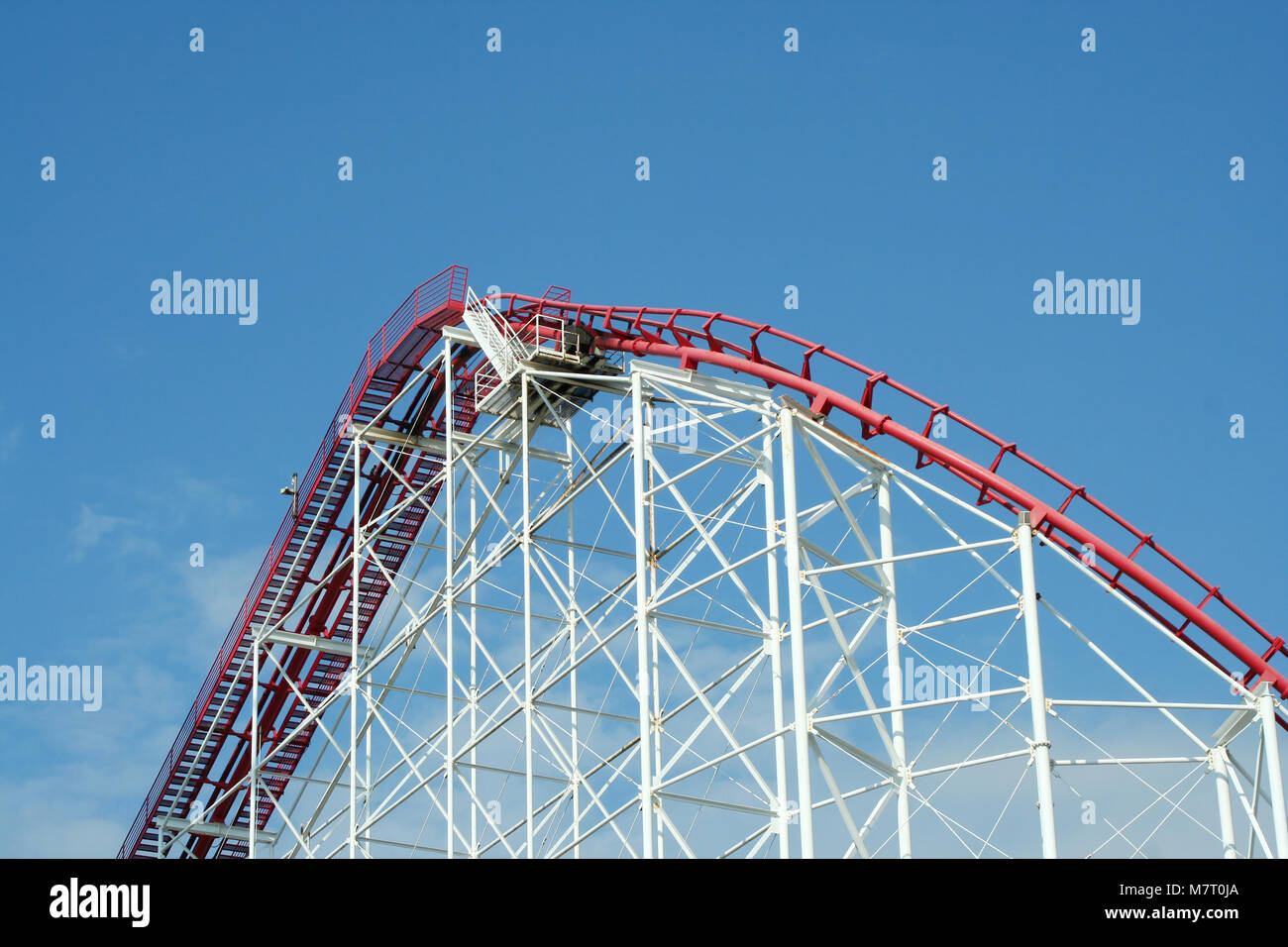A Metal roller coaster against blue sky Stock Photo - Alamy