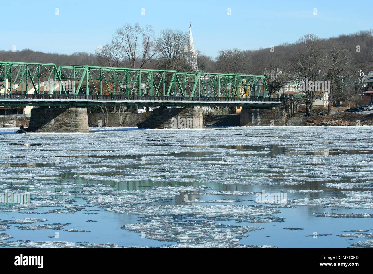 A bridge over a icy river Stock Photo - Alamy