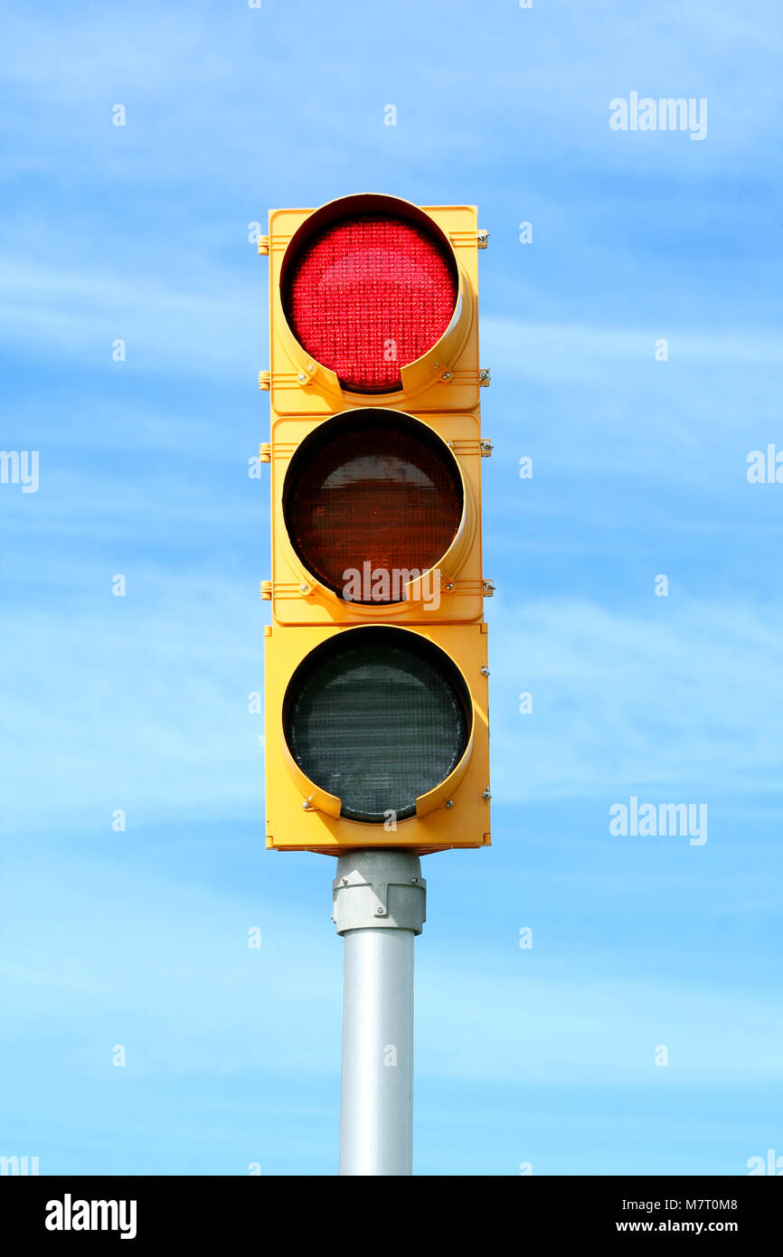 Red traffic signal light on blue sky Stock Photo - Alamy