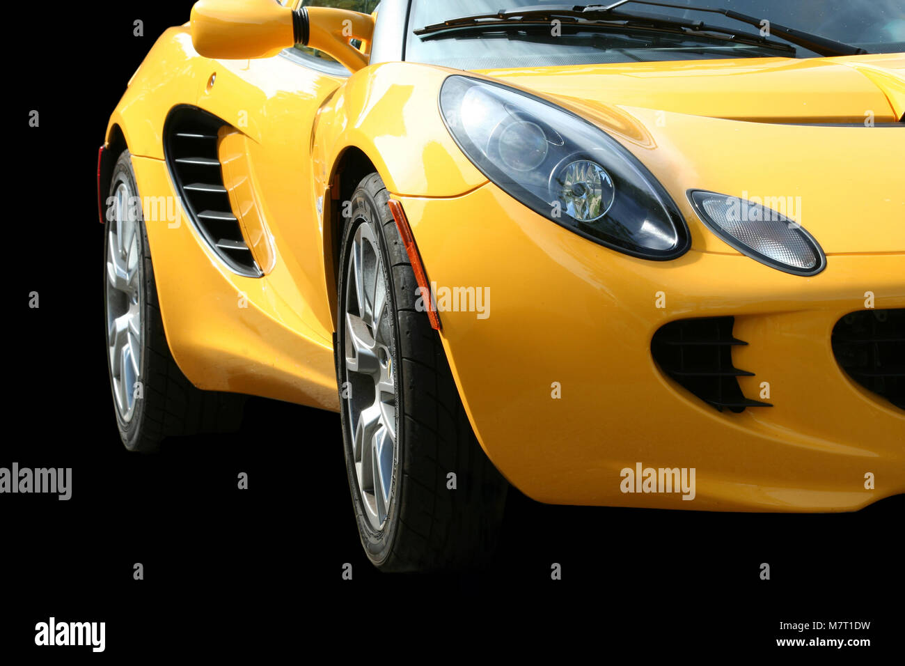 A Isolated yellow sports car on black Stock Photo - Alamy