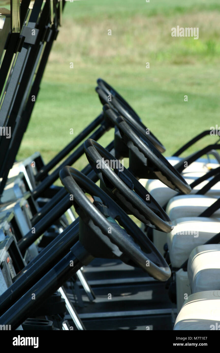A Inside view of a row of golf carts Stock Photo - Alamy