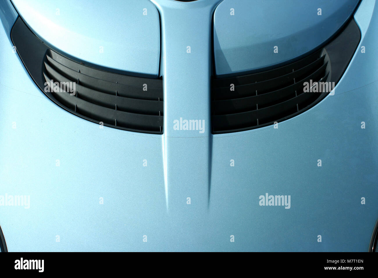 A Blue sports car hood with scoop Stock Photo - Alamy