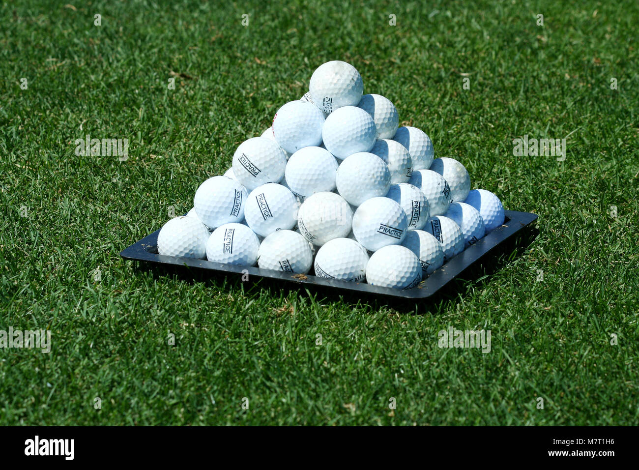 A Pyramid of practice golf balls Stock Photo - Alamy