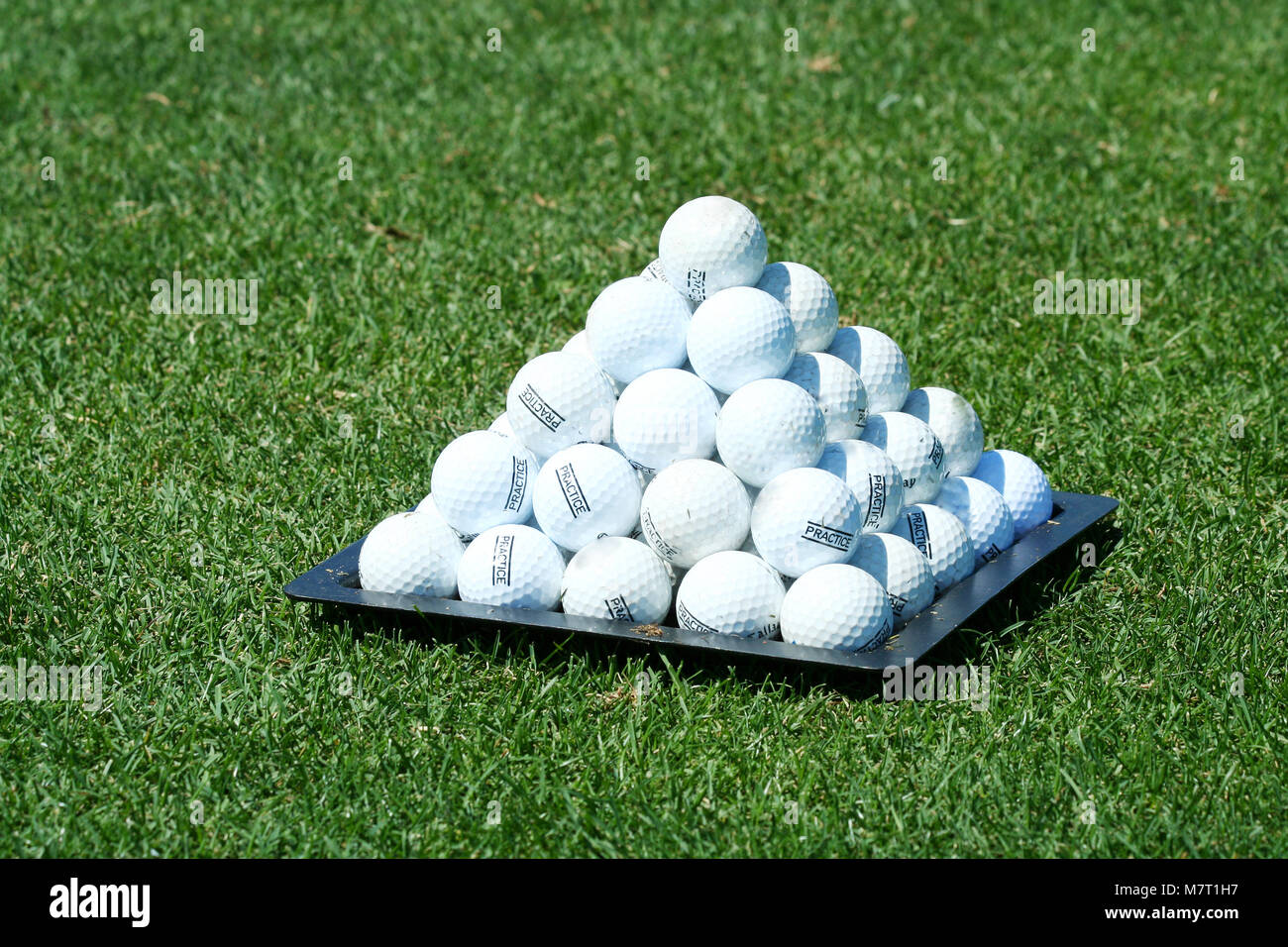 A Pyramid of practice golf balls Stock Photo - Alamy