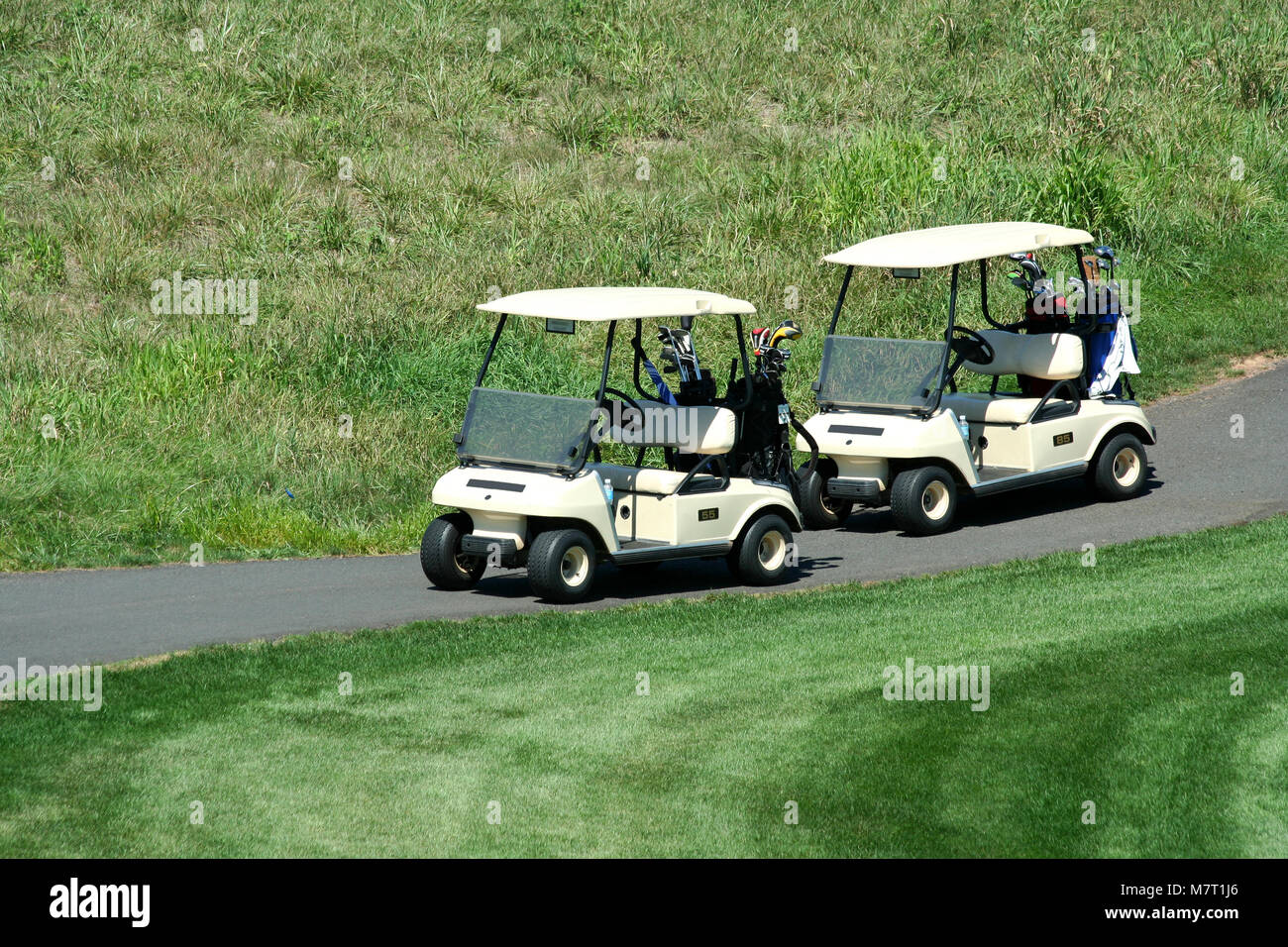 Two golf carts on the cart path Stock Photo - Alamy