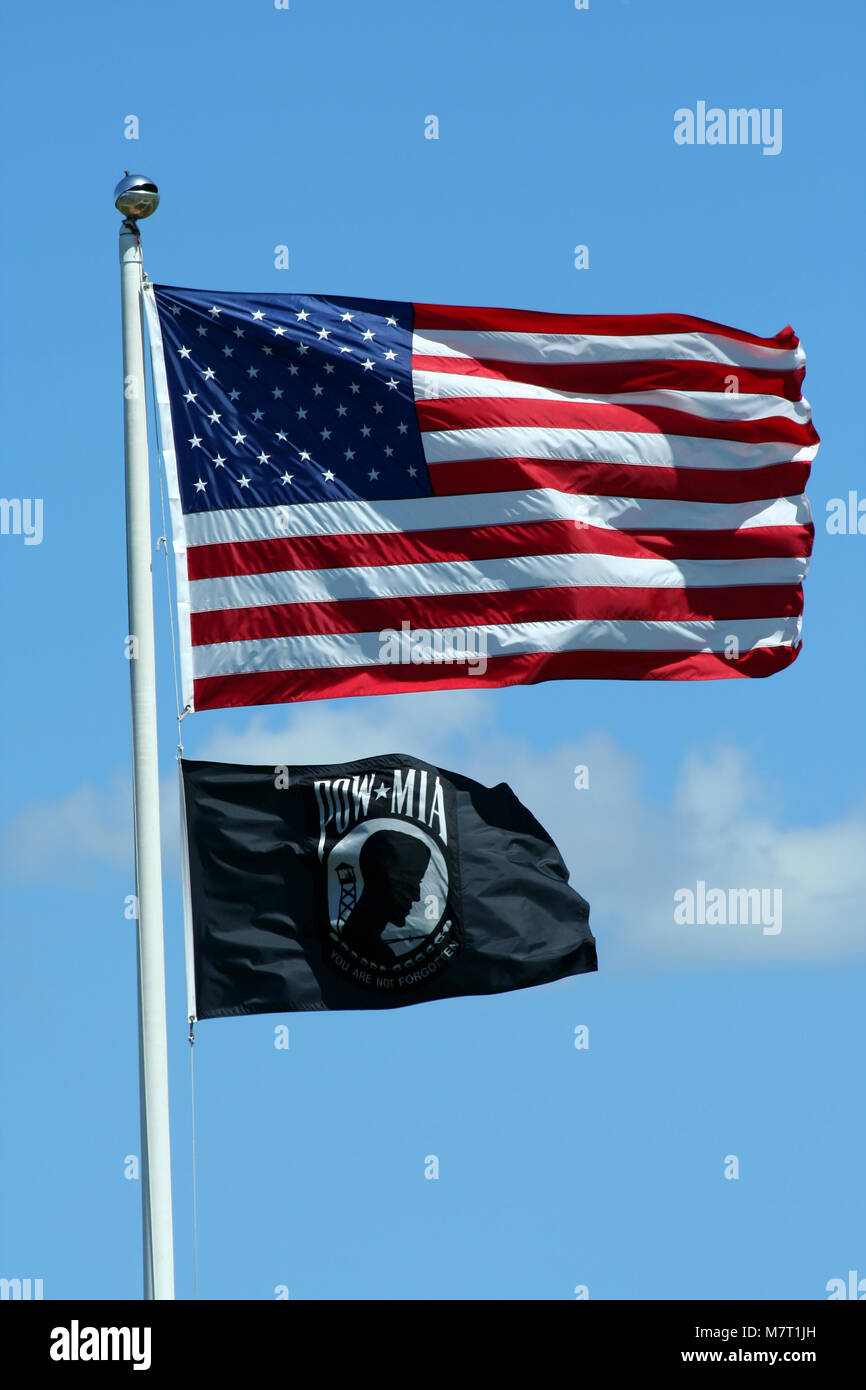 A American and POW flags against a blue sky Stock Photo - Alamy