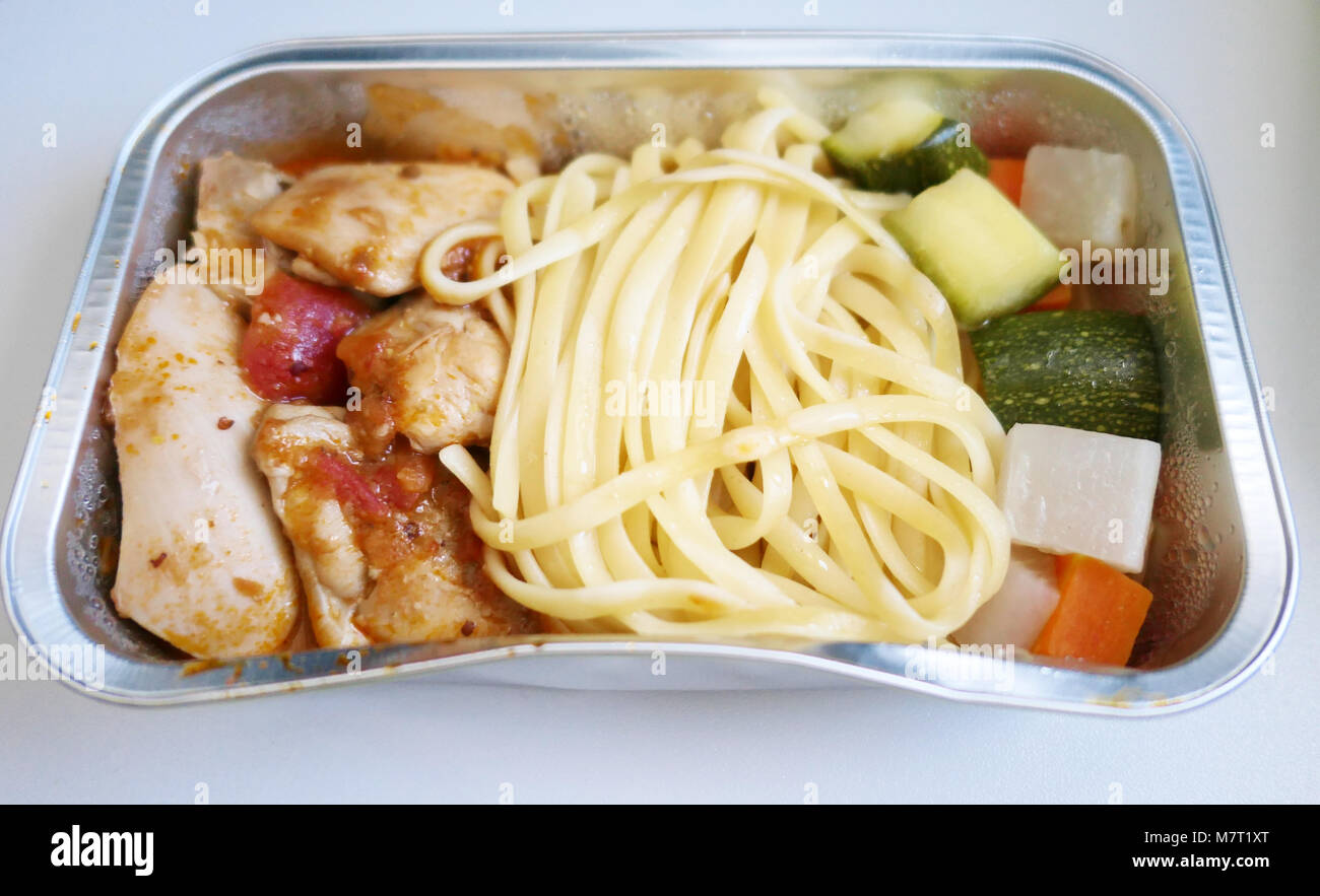 Airplane food, pasta with chicken and vegetables Stock Photo - Alamy