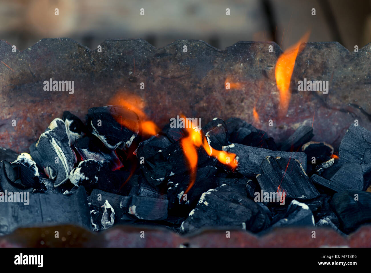 orange flame and black coals - bonfire close-up Stock Photo - Alamy
