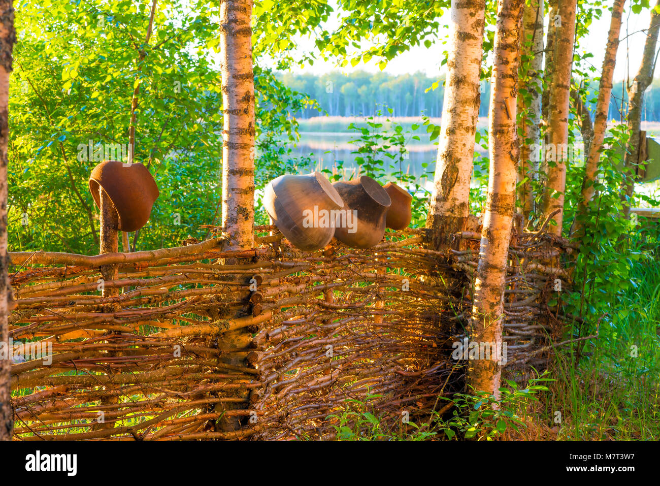 a rural fence and hanging pots in the countryside Stock Photo - Alamy