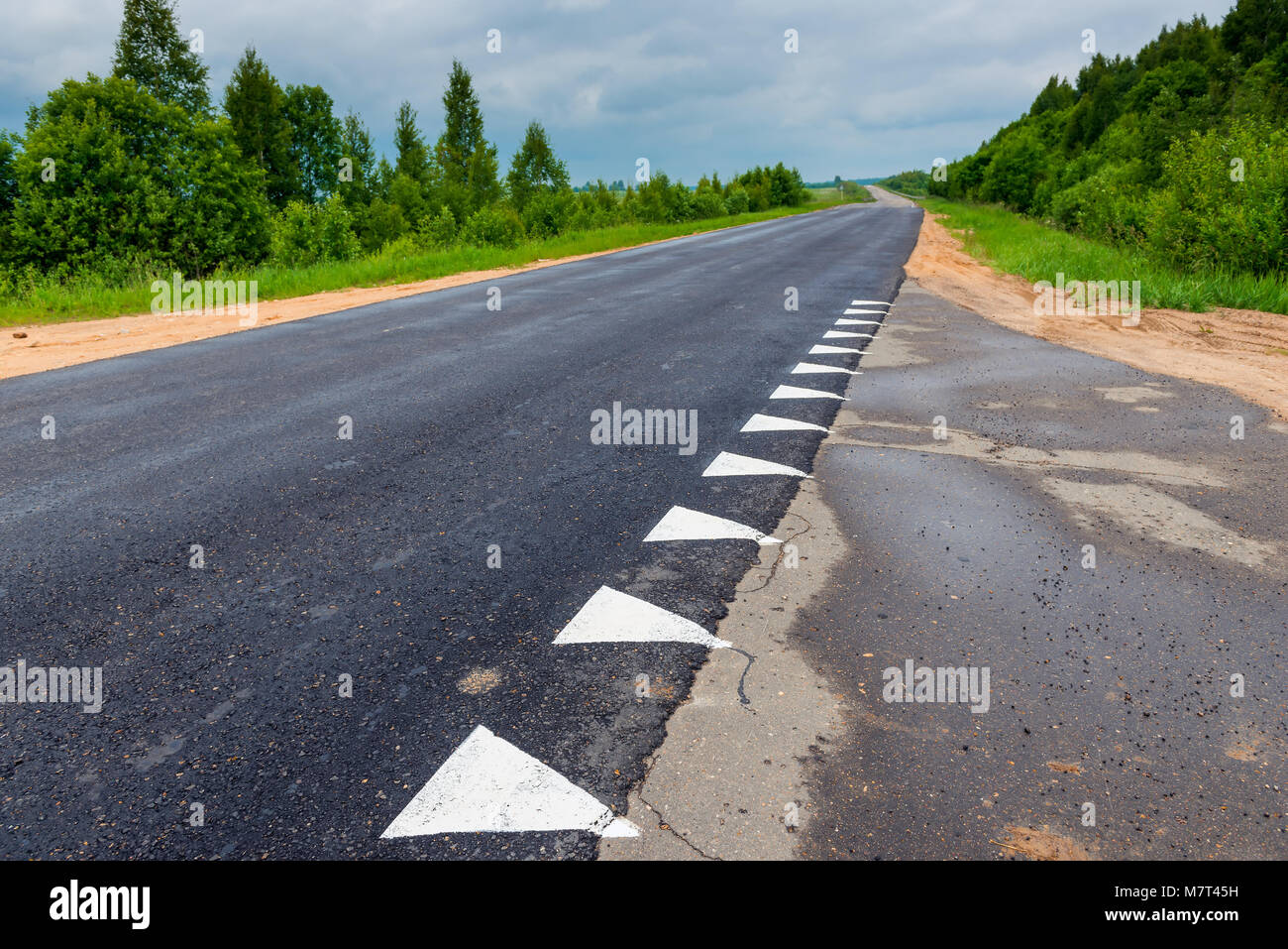 asphalted country road, intersection of two roads Stock Photo - Alamy