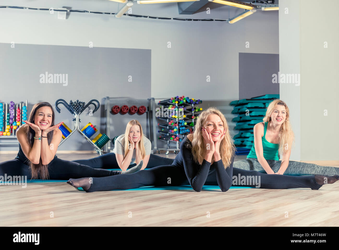 cheerful girls repeat for the coach exercises for balance and ...