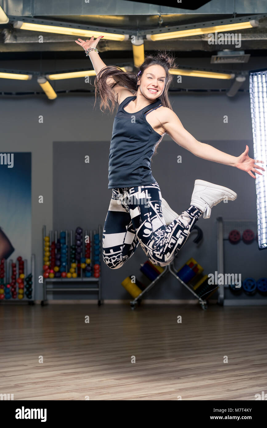 jumping young dancer during a dance in the gym Stock Photo - Alamy