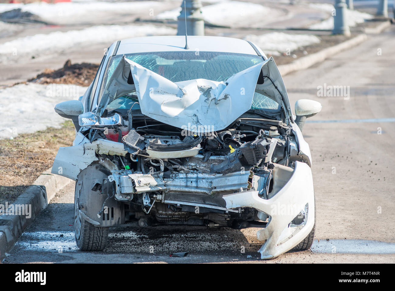 white broken car on the road in the city close up Stock Photo - Alamy