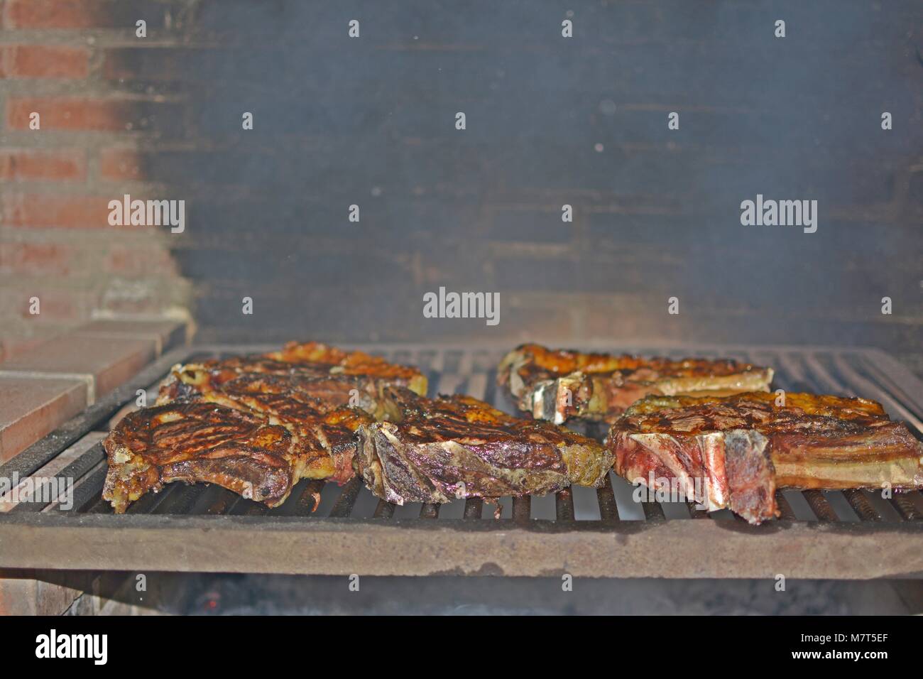Tasty Beef Steak over the grill Barbeque Stock Photo - Alamy