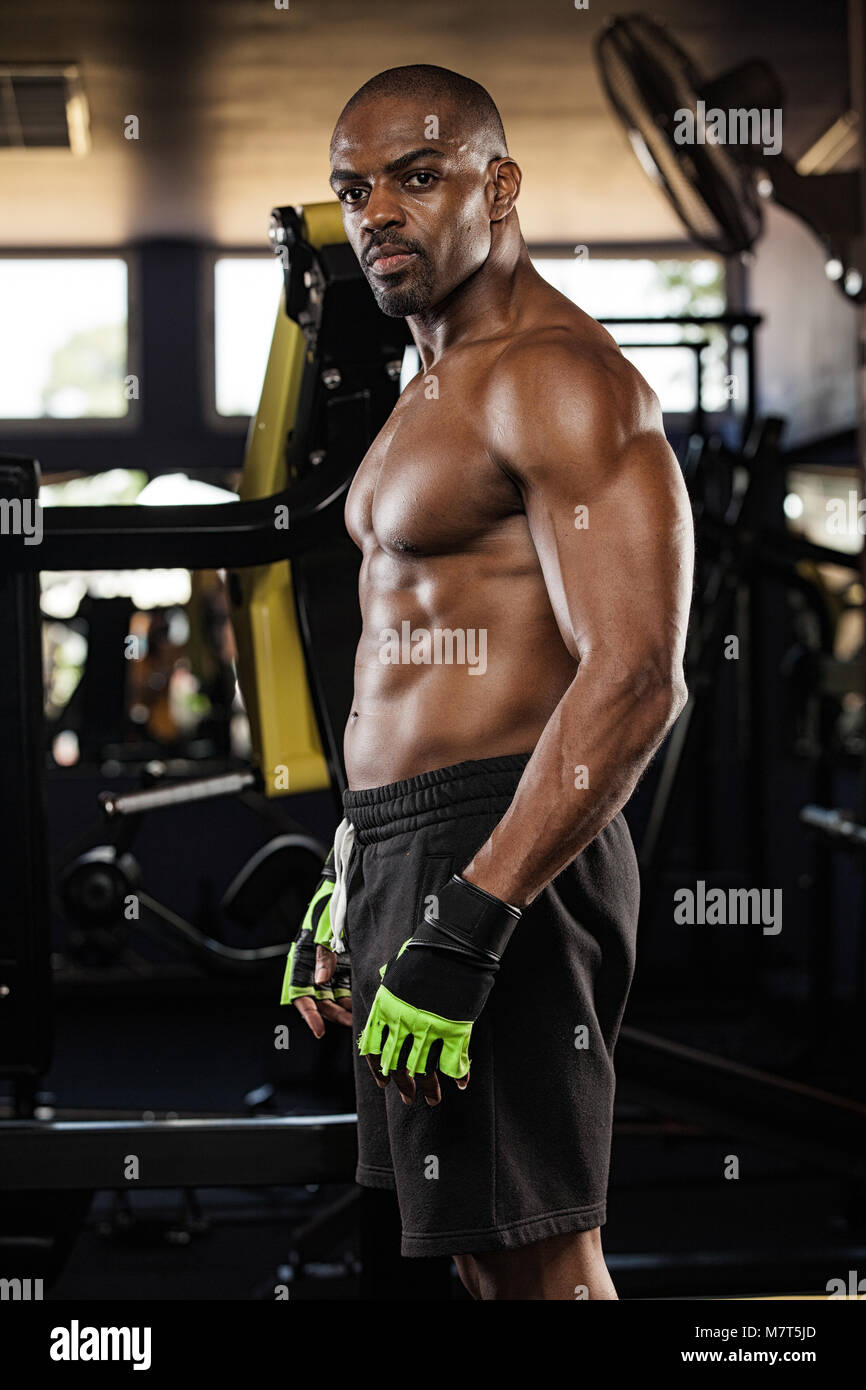 Athlete muscular brutal bodybuilder emotional posing in the gym Stock ...