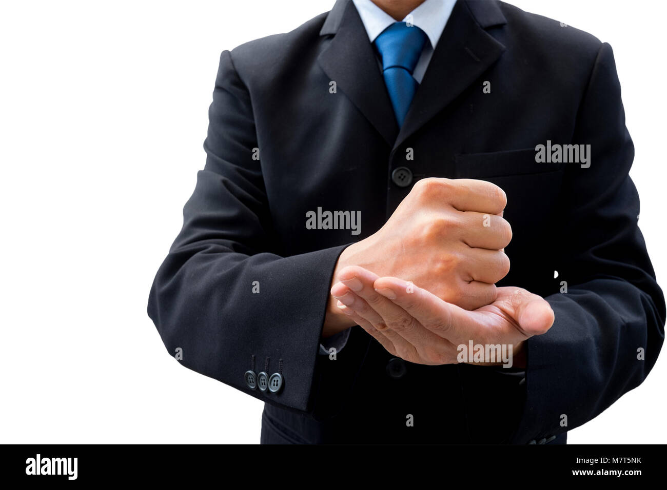 Businessman in dark gray suit putting his right fist on his left palm ...