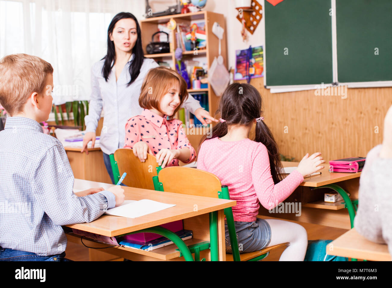 Teacher starts the lesson Stock Photo - Alamy