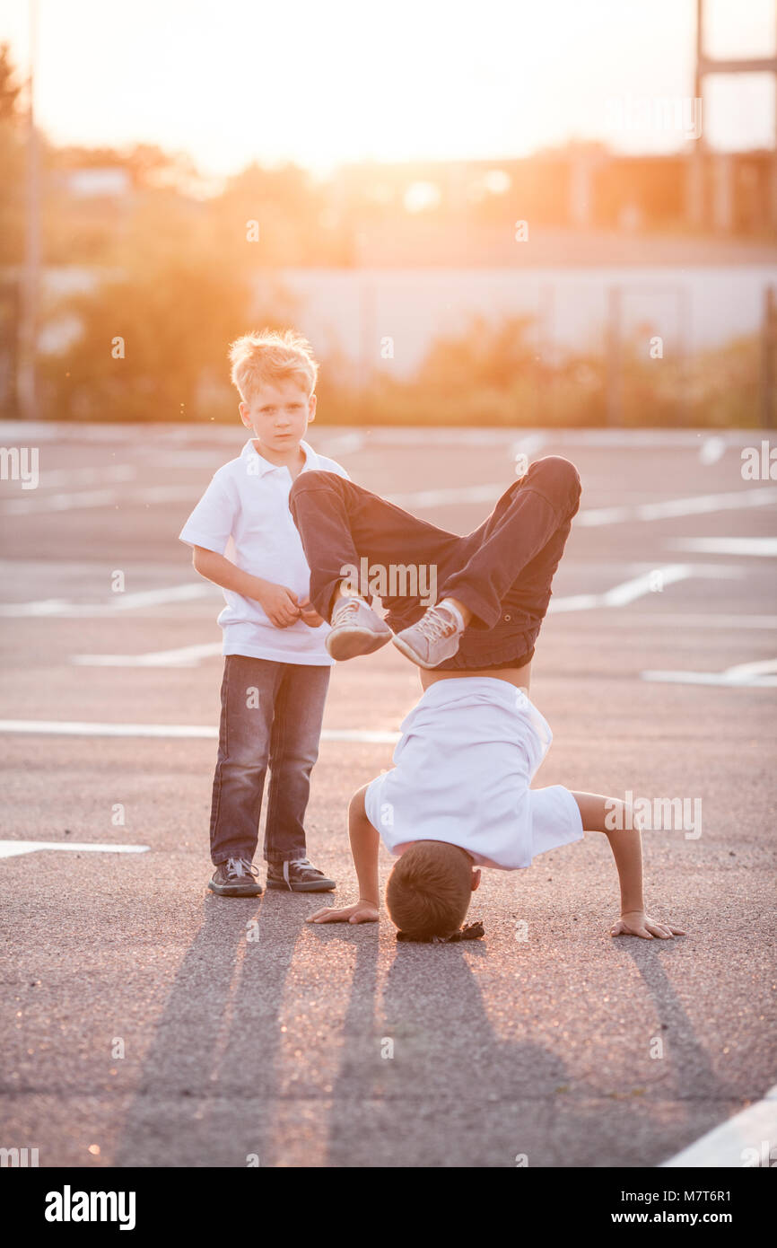 The boy standing upside down Stock Photo - Alamy