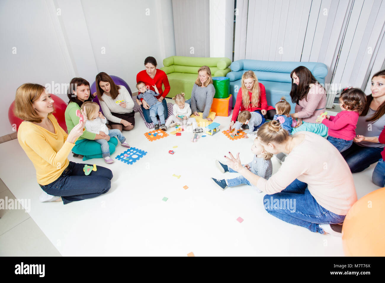 Young moms with their kids Stock Photo - Alamy