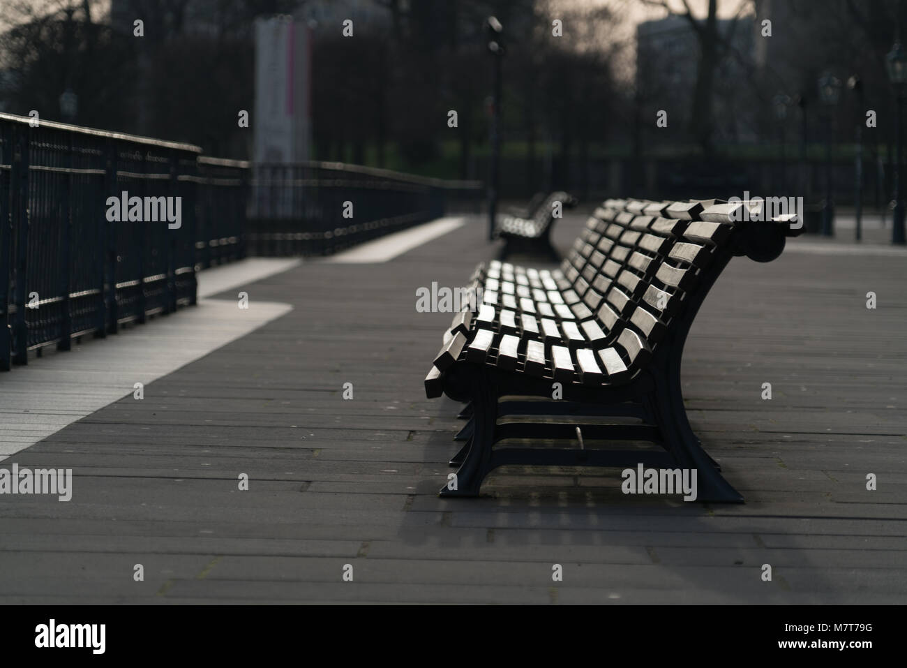 Wooden bench in the city Stock Photo - Alamy