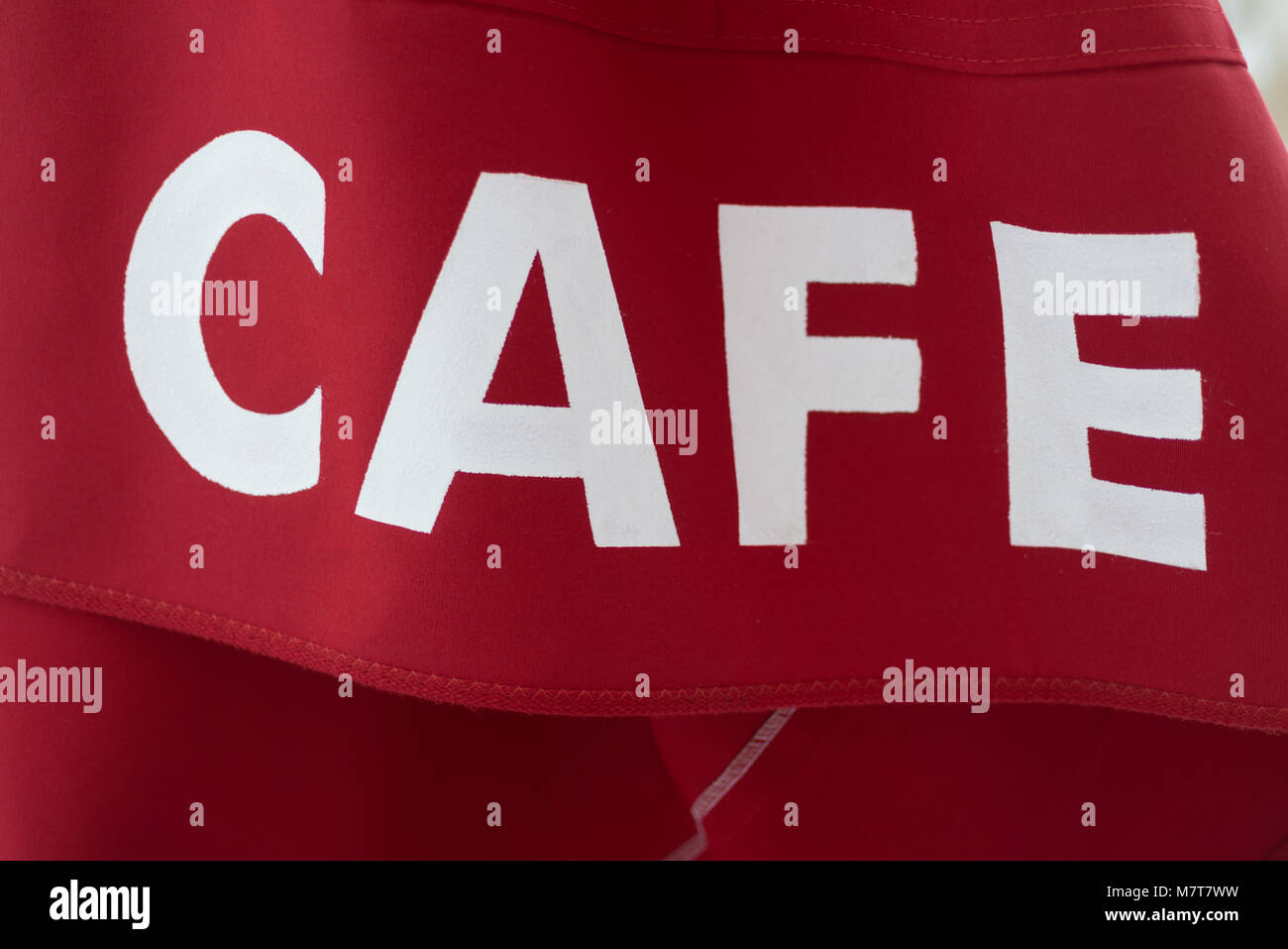 bright red and white cafe sign banner on cloth material Stock Photo - Alamy